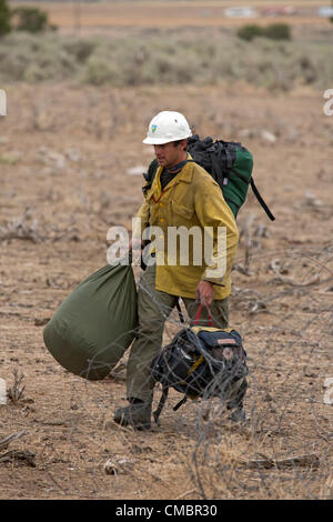 Firemen Smoke Jumpers parachute into wildfire forest fire area to start ...