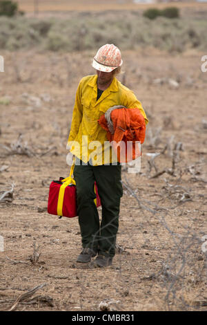 Firemen Smoke Jumpers parachute into wildfire forest fire area to start ...