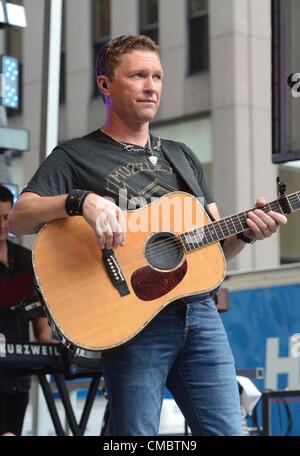 NEW YORK, USA - JULY 13: life-sized statues placedon rooftops around ...