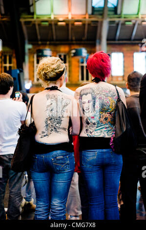 Manchester, UK - 5 August 2012: a tattooed girl poses for a picture ...