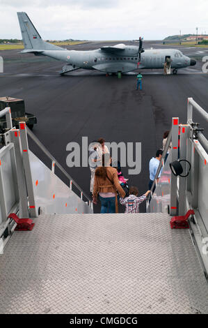 Visitors explore a range of military aircraft and helicopters during ...