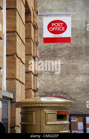 Sherborne, Dorset, UK Monday 6 August 2012. Royal mail gold painted ...