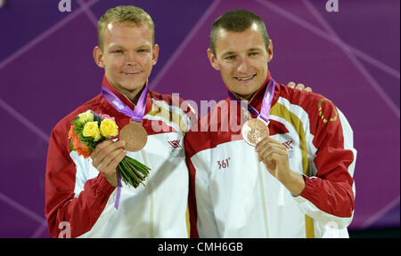 Bronze medalist Janis Smedins (L) and Martins Plavins of Latvia pose ...