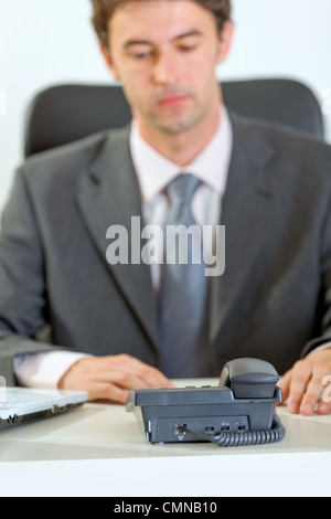 Businessman expecting important call on phone Stock Photo - Alamy