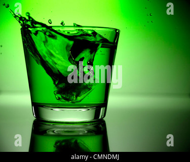 Colorful splashing drink with reflections Stock Photo - Alamy