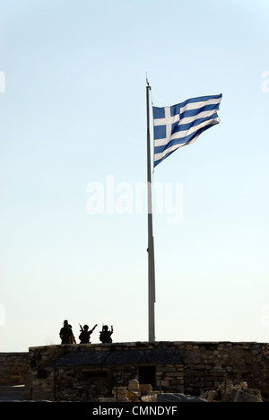 Soldiers salute the flag during the National Anthem at an award ...