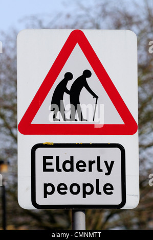 Warning sign with elderly people symbol Stock Photo - Alamy