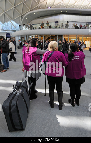 Railway station and train with a Customer Service dispatcher standing ...
