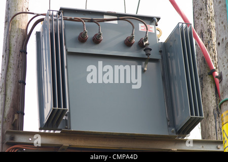 Domestic power supply transformer on H-frame Stock Photo - Alamy