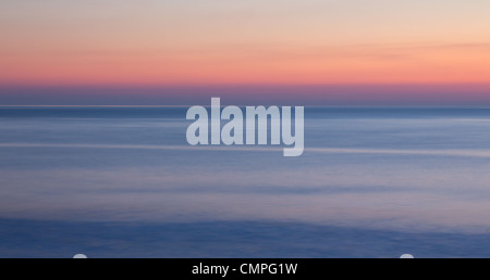 Panorama of a dramatic sunset sky with orange and pink clouds and light ...