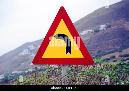 Greek traffic sign indicating a sharp left turn Stock Photo - Alamy