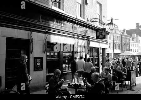 A busy street scene in Cambridge looking onto Great St Mary's, the ...