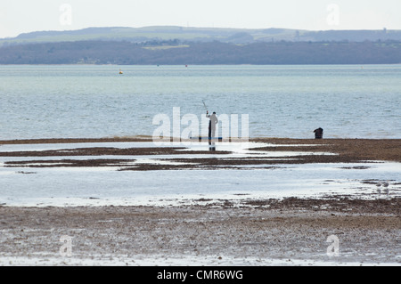 Man fishing off Meon Shore - Hampshire UK Stock Photo - Alamy