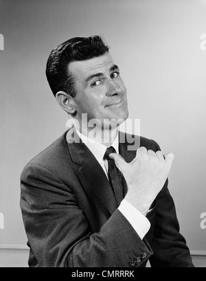 1950s MAN SMILING BUSINESSMAN PROUD LOOK OF SATISFACTION WALKING OUT ...