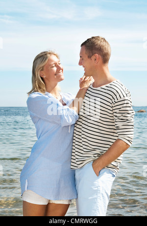 Two couples on the beach Stock Photo - Alamy
