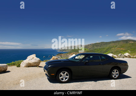 car parked near cliff edge in usa california with blue sky and sea ...