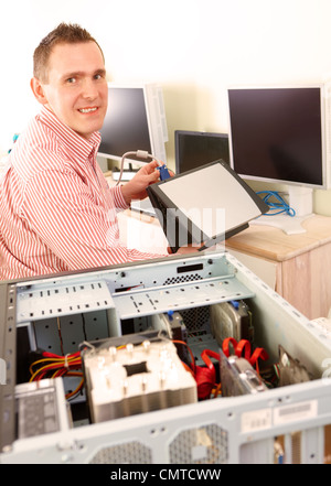man waiting for technical support service sitting on the hood of an ...
