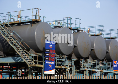 petrol oil and diesel overhead storage tanks at a commercial fuelling ...