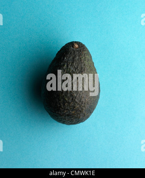 Single fruit on blue chop board aerial view Stock Photo - Alamy