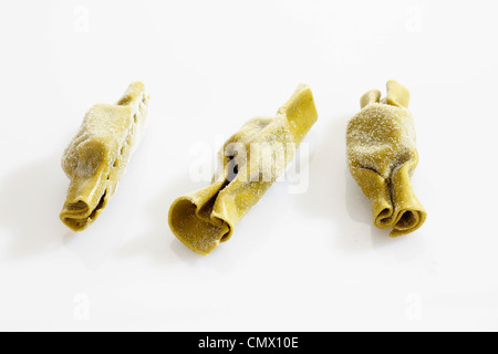 Candy shape pasta with riceflour on white background Stock Photo - Alamy