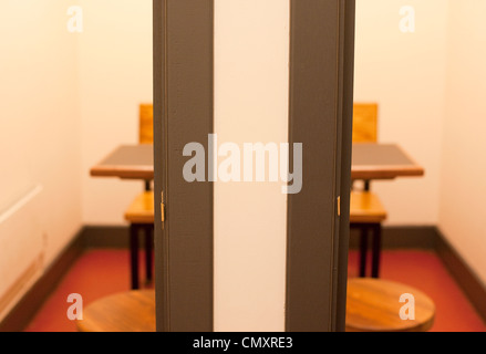 A corridor with doors to holding cells in the basement of the Sheriff ...