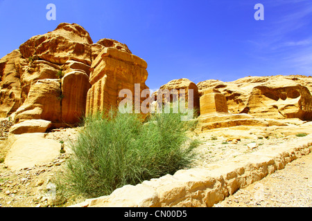 Ancient stone monastery buildings with orange roofs sit precariously on ...