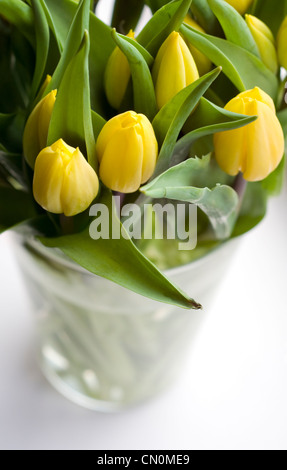 tulip flowers bouquet in vase on wooden background Stock Photo - Alamy