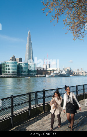 People seen walking at river Thames boulevard in Southbank district ...