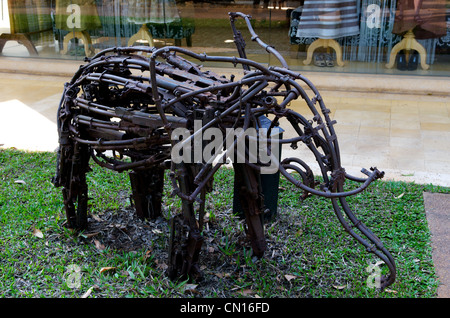 A sculpture made from the parts of guns and other weapons titled ...