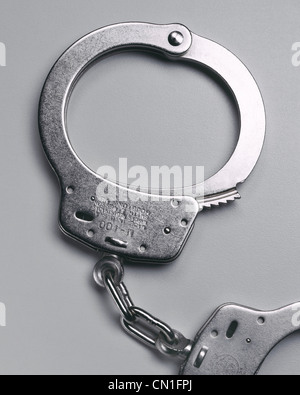 Police law steel handcuffs arrest crime human foot Stock Photo - Alamy