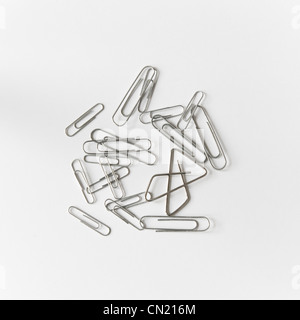 Metal paper clips on a white background. office supplies isolate Stock ...