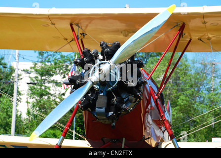 Biplane at an old fashioned airfield. This maroon fabric covered ...