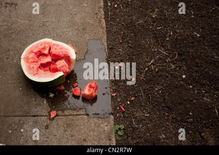Broken watermelon on sidewalk Stock Photo - Alamy