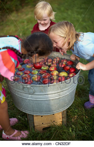 Children apple bobbing Stock Photo: 47396640 - Alamy