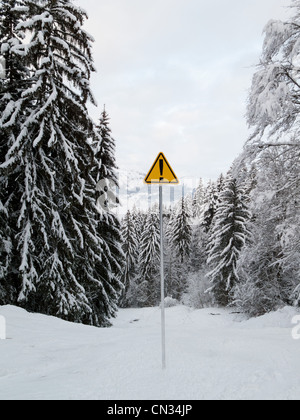 Warning sign and snow. Exclamation mark Stock Photo - Alamy