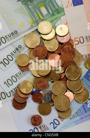 Falling Euro banknotes and coins isolated Stock Photo - Alamy
