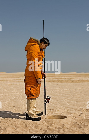 Eskimo fishing in desert Stock Photo - Alamy