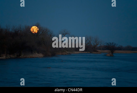 Kearney, Nebraska - A full moon sets over the Platte River Stock Photo ...