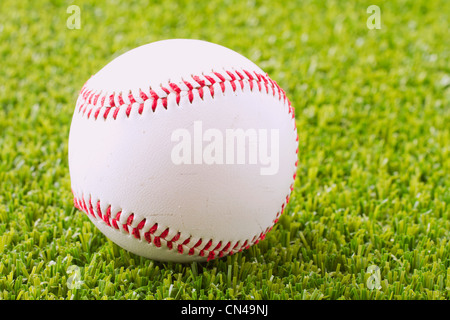 white baseball on green grass sports course Stock Photo - Alamy