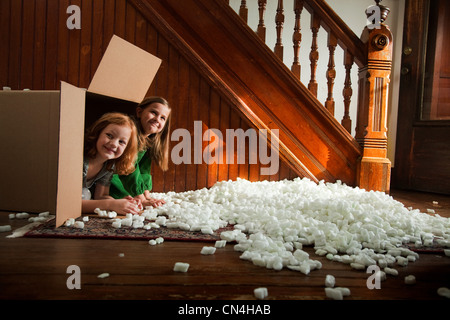 child playing and hiding in cardboard box. Photo by Willy Matheisl ...
