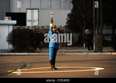 PYONGYANG, North Korea - North Korean police try to put an angry Stock ...