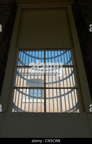 prisoner looking out of the window of a prison cell Stock Photo - Alamy