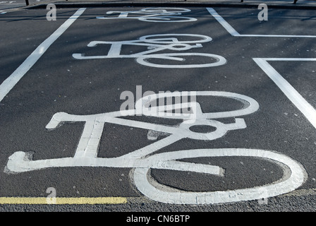 british road junction with advanced stop line, or cycle box, marked by ...