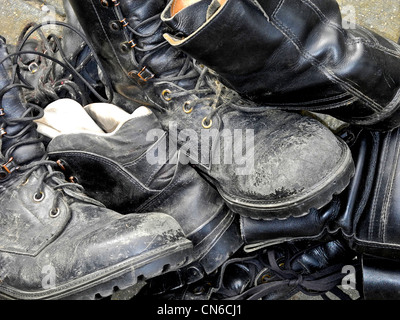A pile of old boots Stock Photo - Alamy