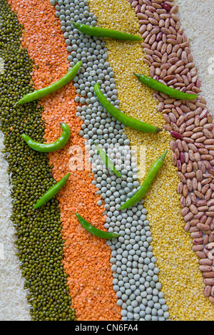 Assortment of dry organic beans and lentils in glass jar on marble ...