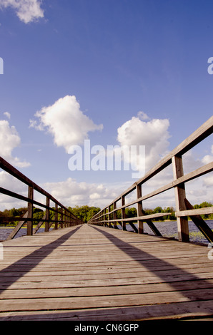 Wooden bridge over Sirvenos lake in Birzai, Lithuania Stock Photo - Alamy
