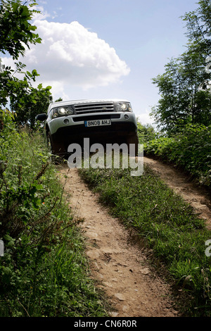 Range Rover drives over uneven, hilly conditions Stock Photo - Alamy