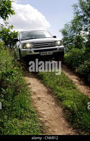 Range Rover drives over uneven, hilly conditions Stock Photo - Alamy