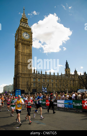 Marathon runners passing Big Ben during the London Marathon. London, UK ...