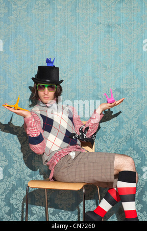 Young handsome man holding paper with red heart very happy and excited ...